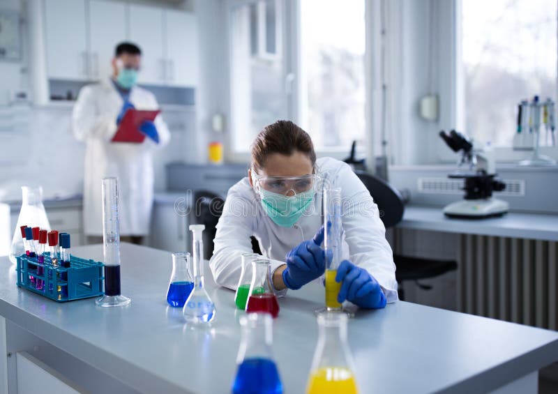 Biologists Working in Laboratory with Chemicals Stock Image - Image of ...