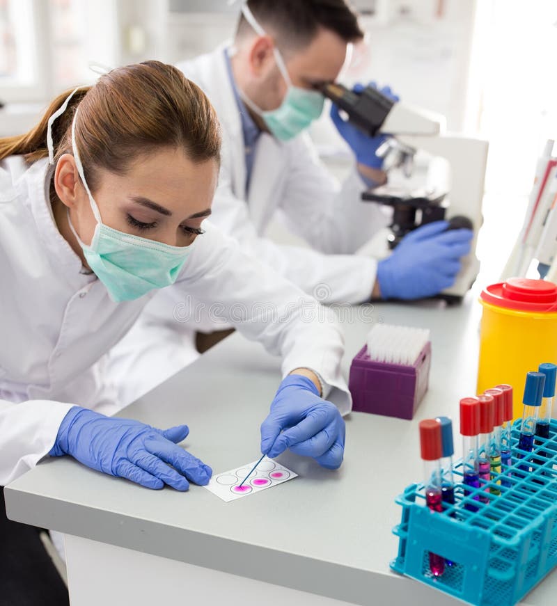 Team of Biologists in White Coats in Laboratory Stock Image - Image of ...