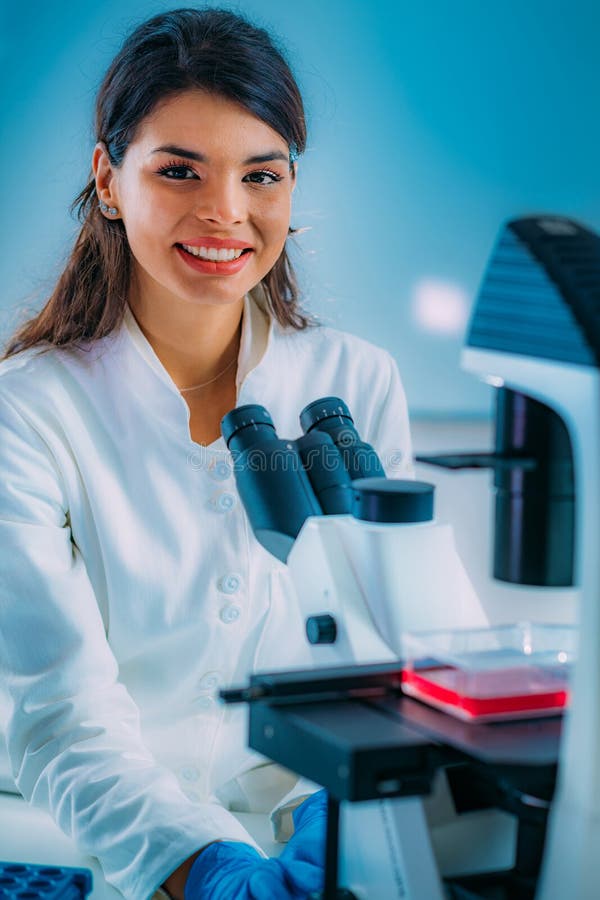 Biology Student Researcher Looking through the Microscope Stock Photo ...