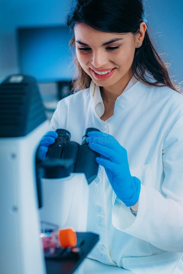 Biology Student Researcher Looking through the Microscope Stock Image ...