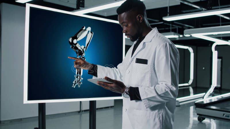 Biomedical Engineer Controlling Holographic Prosthesis with Tablet ...