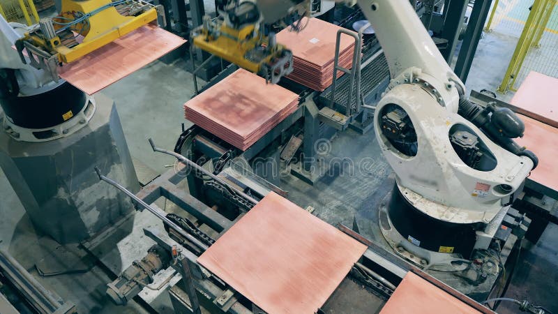 Robotized Mechanisms are Moving Copper Plates Around. Robotic Equipment ...