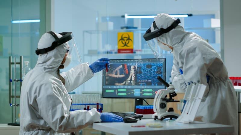 Biotechnology Scientist Wearing Ppe Suit Researching in Equipped ...