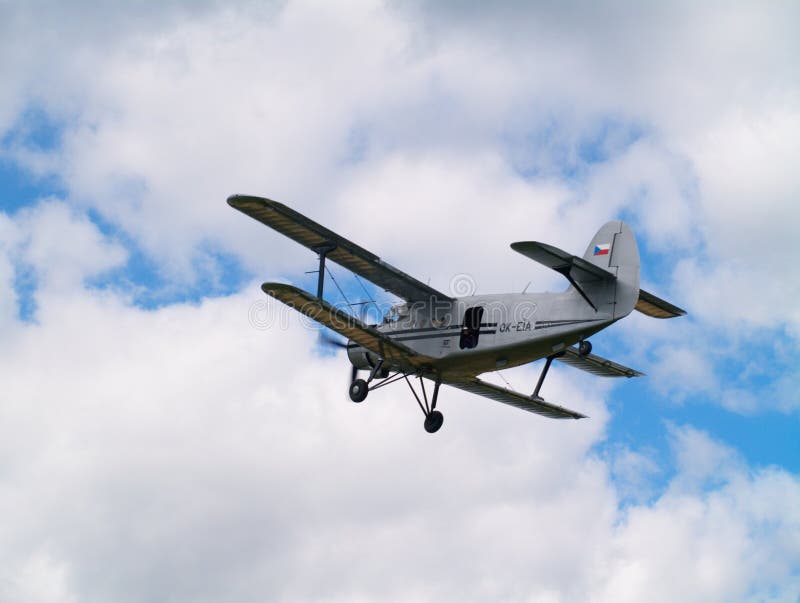 Biplane in the sky stock photo. Image of airfield, clouds - 7099184