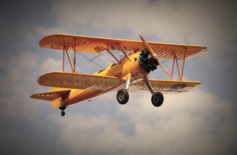 Flying Biplane Over a Airfield. Stock Photo - Image of green, enjoy ...