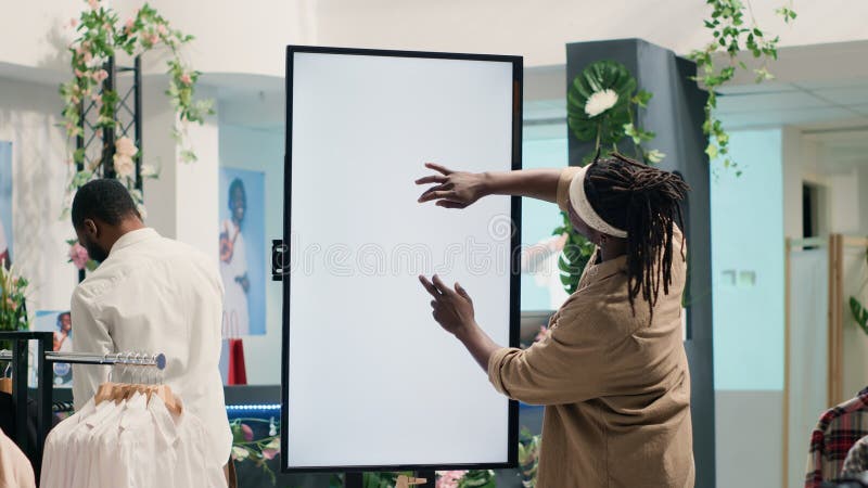 Man Picks Clothes on Fashion Store Kiosk Stock Image - Image of display ...