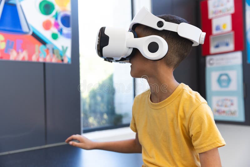 Biracial Boy Explores Virtual Reality at School Stock Photo - Image of ...
