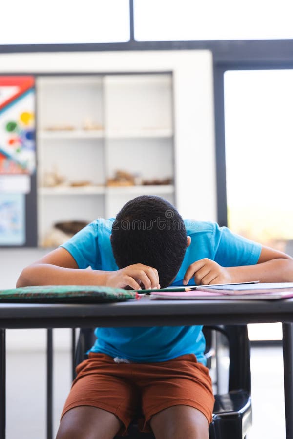 Biracial Boy Focused on Drawing in the Classroom at School Stock Image ...