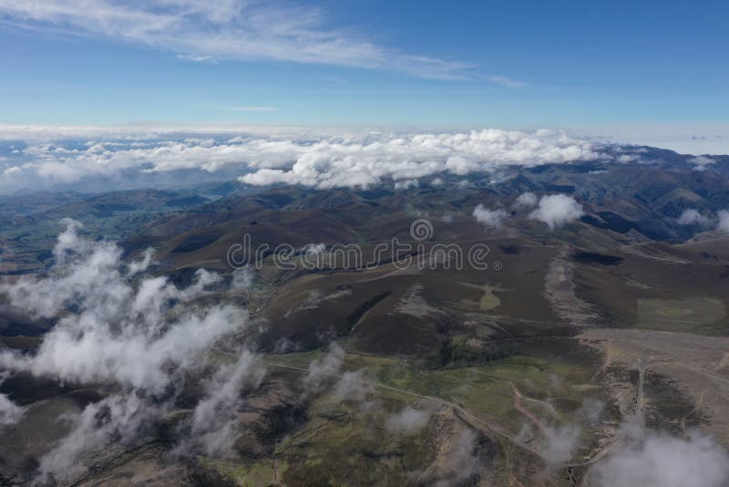 Bird Eye View of Clouds that are Running Over a Mountainous Green ...