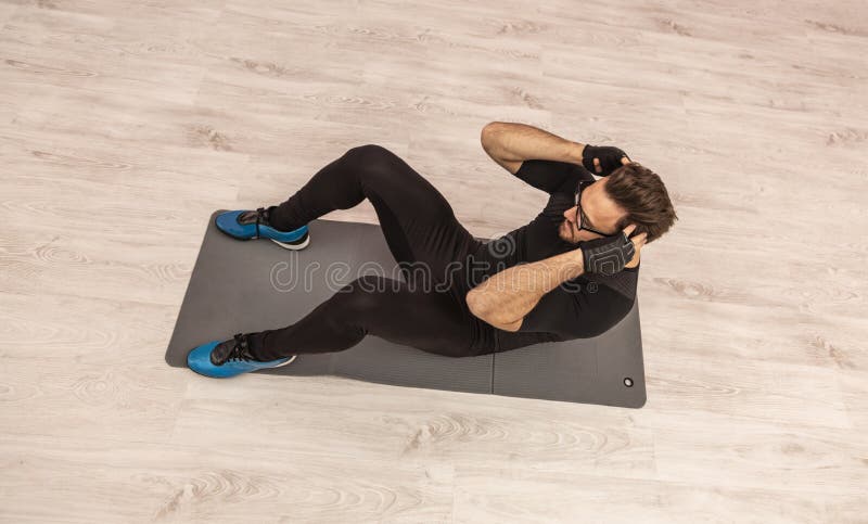 Man Doing Sit-ups stock photo. Image of abdomen, glasses - 164498246