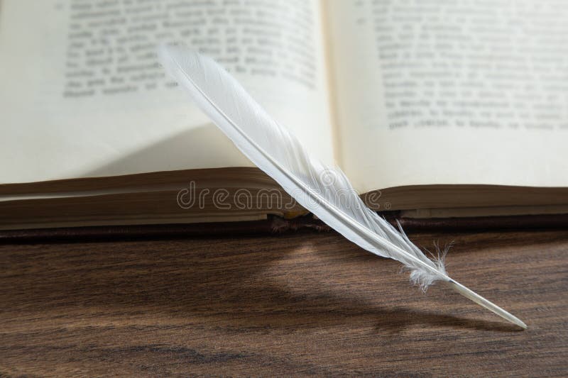 Bird Feather and Book on the Wooden Table Stock Image - Image of desk ...