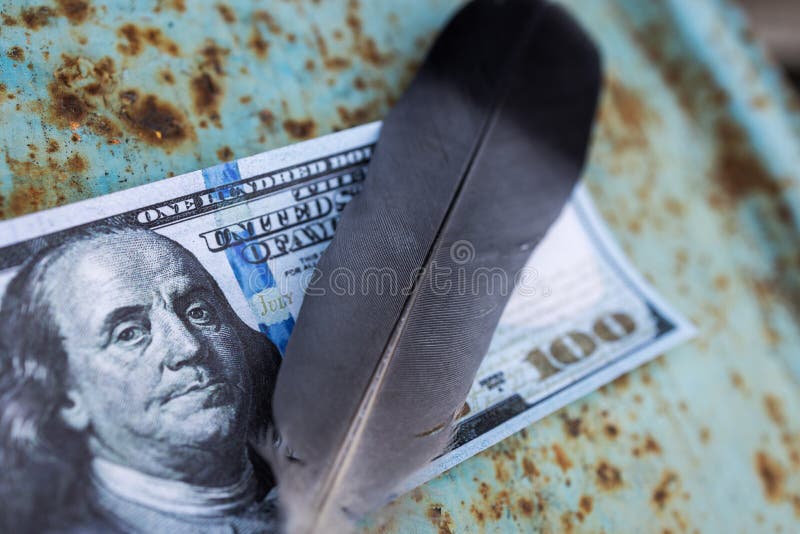 Bird Feather and Money on a Cold Surface of Old Metal Stock Photo ...