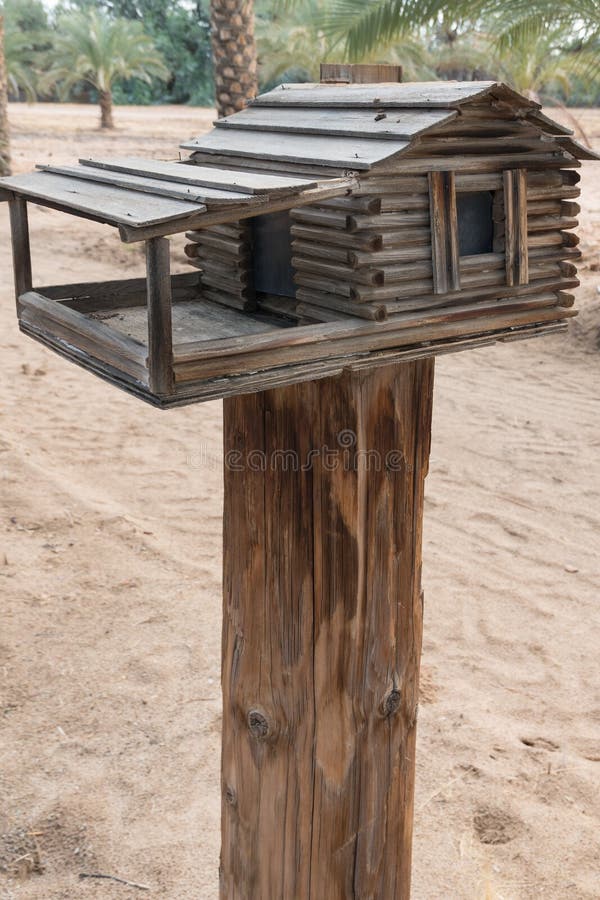 Bird feeder on a post stock photo. Image of colored - 208558126