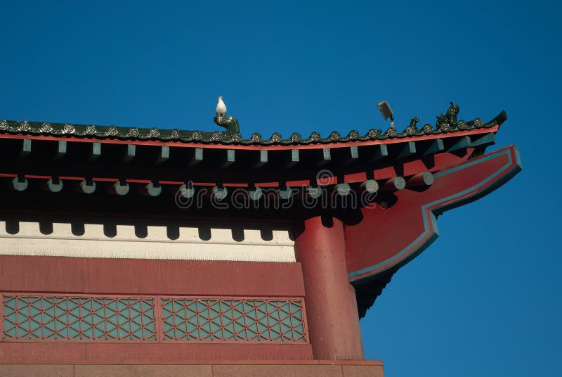 Bird Perched on the Roof of an Asian-style Building. Stock Photo ...