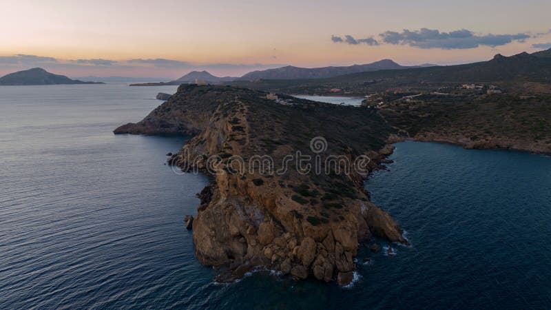 Bird S Eye View of a Coastal Cliff Surrounded by Water Seen during the ...