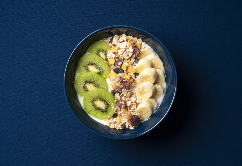 Granola and Fruit on a Dark Blue Background Stock Photo - Image of ...