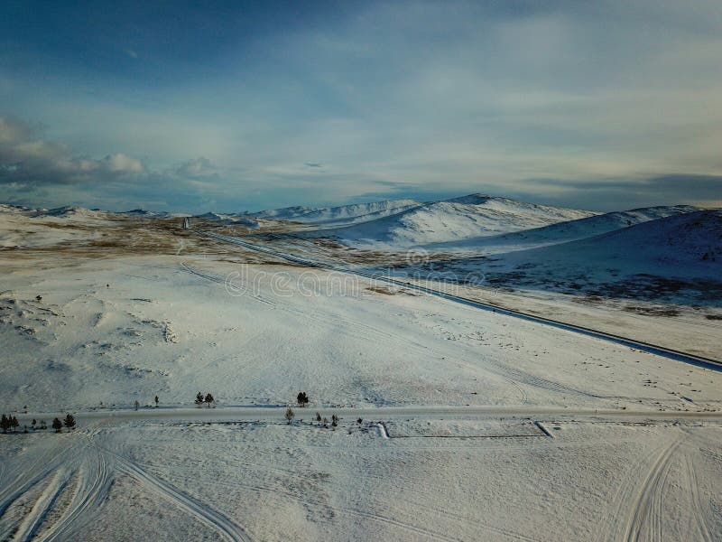A Bird S Eye View of a Ridgeline Half-covered with Snow in a Forest ...