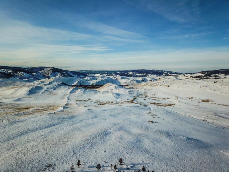 A Bird S Eye View of a Ridgeline Half-covered with Snow in a Forest ...
