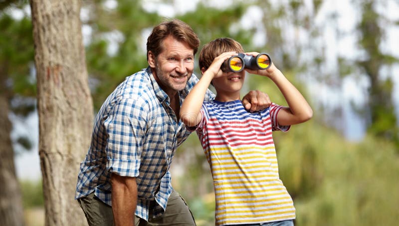 Bird-watching is Fun. a Young Boy Looking through Binoculars while with ...