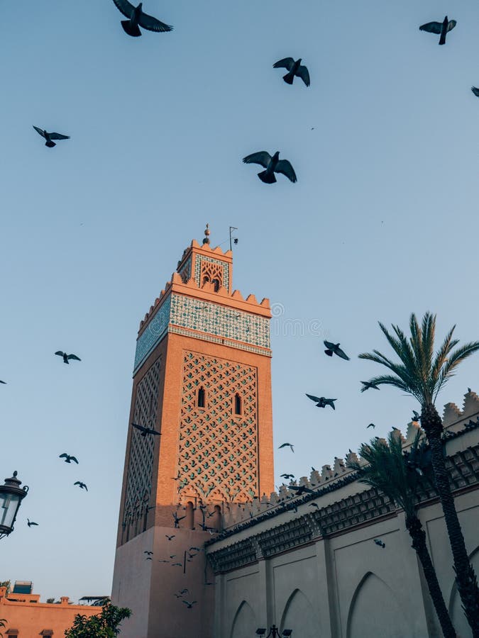 Birds Circling the Minaret Tower of a Mosque in Marrakech, Morocco ...