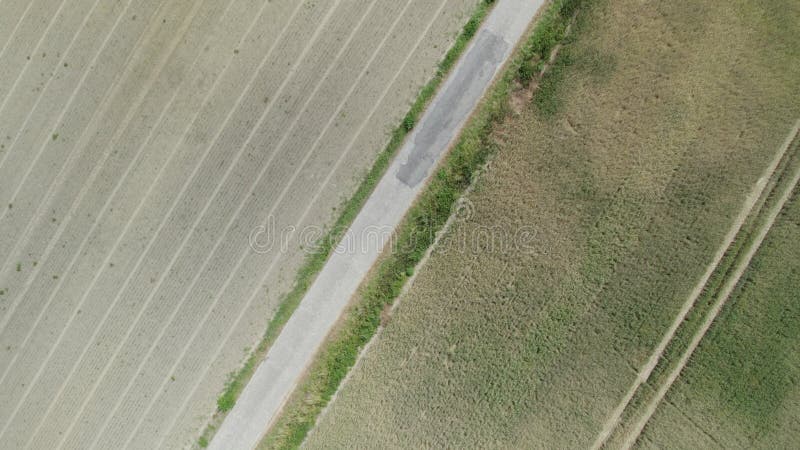 Sowing Season Split: Aerial Spin Over Contrast Farmfields Stock Footage ...