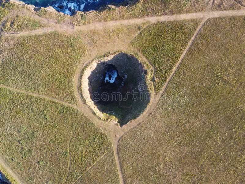 Birds Eye View Shot of the Hole in Cornwall with Coastal Paths ...