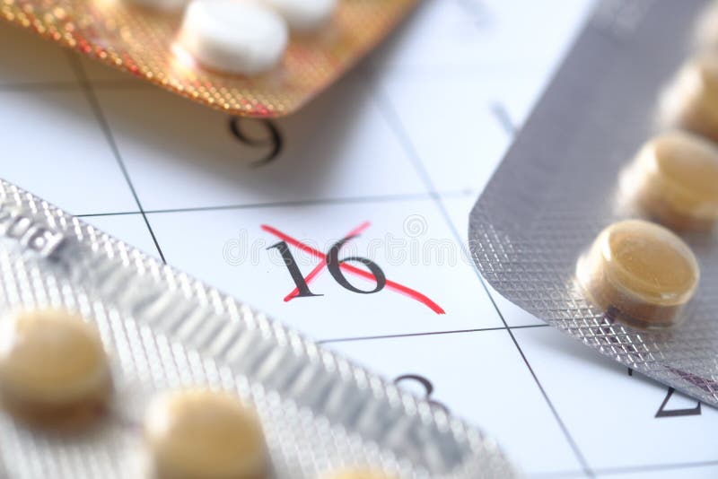 Birth Control Pills and Calendar with Red Mark on Table Stock Image ...