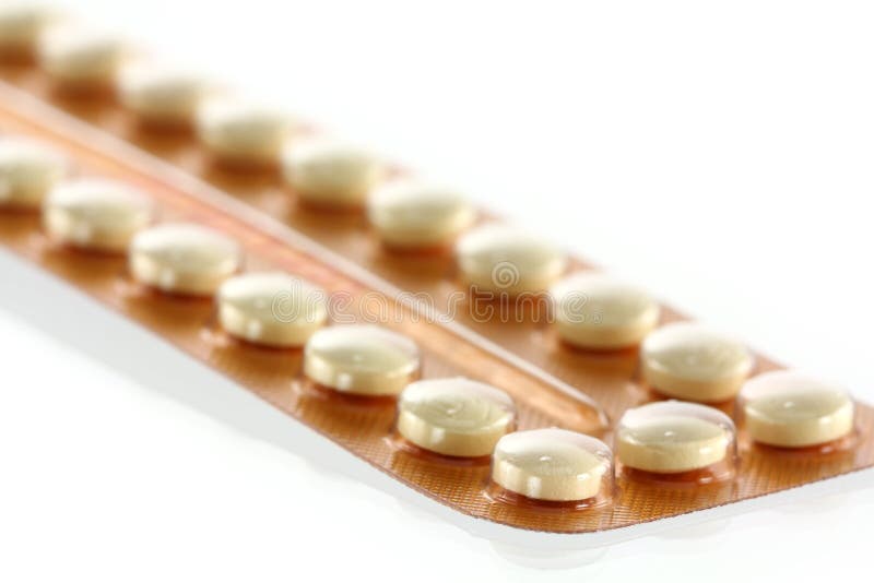 Birth Control Pills and a Condom with a Pinhole Stock Photo - Image of ...