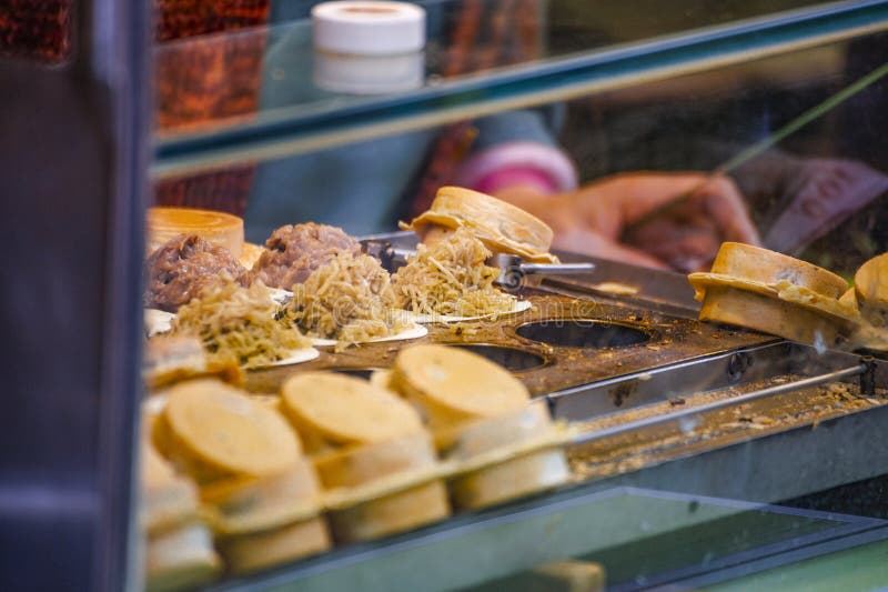 The Birth of Wheel Cakes stock photo. Image of public - 305012220