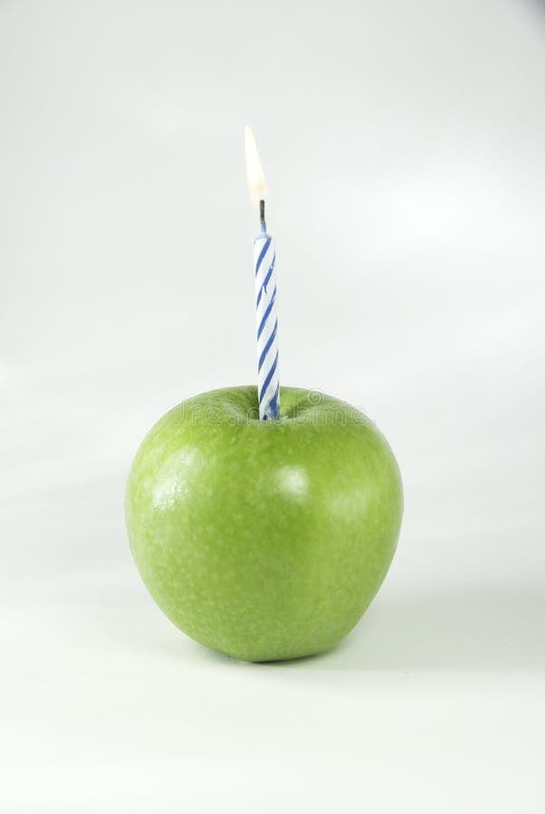 Birthday Apple with flame stock photo. Image of green - 8502310