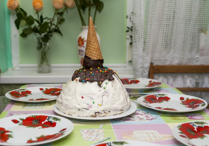 Birthday Cake in the Form of a Cone with Ice Cream on the Table Stock ...