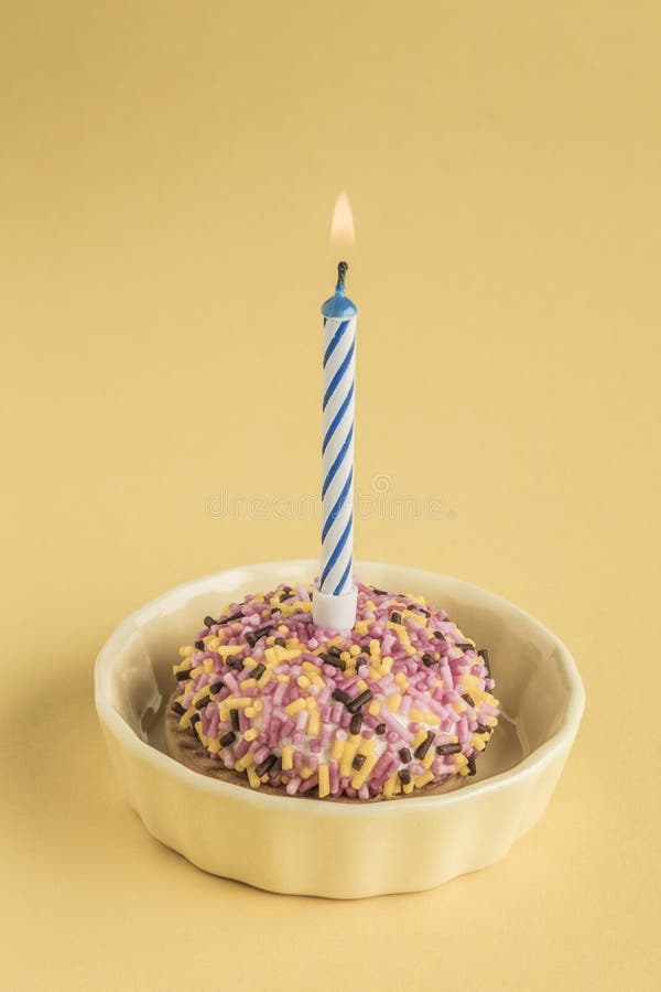 Birthday Cake with One Candle on Yellow Stock Image - Image of candle ...