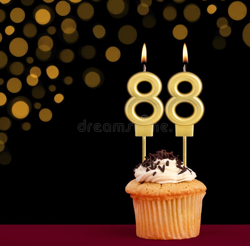 Number 88 Birthday Candle - Cupcake on Black Background with Out of ...