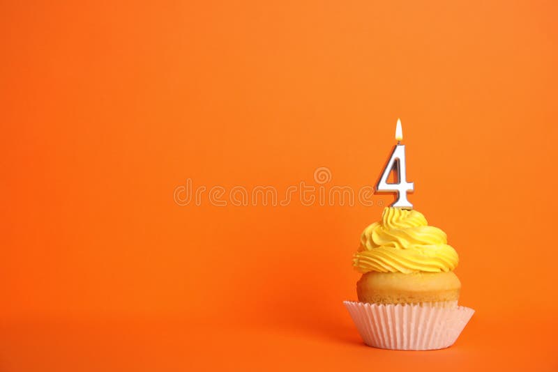 Birthday Cupcake with Number Four Candle on Orange , Space for Text ...