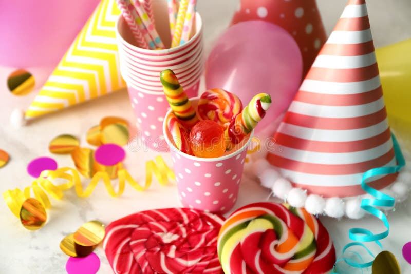 Birthday Party Items with Candies on Table Stock Photo - Image of ...