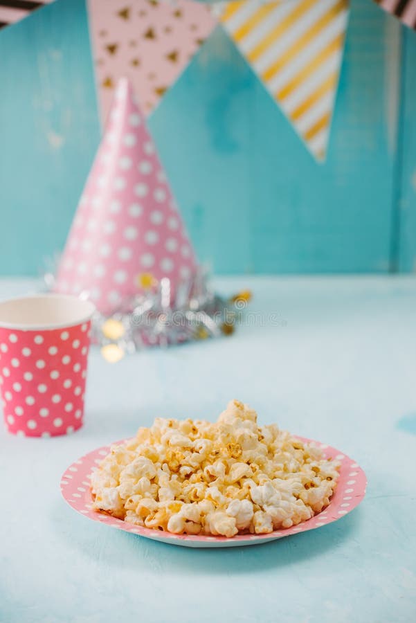 Birthday Party Items with Popcorn on Table Stock Image - Image of ...