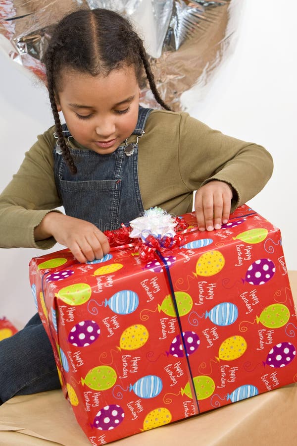 Birthday Present stock image. Image of unwrapping, racial - 6044521
