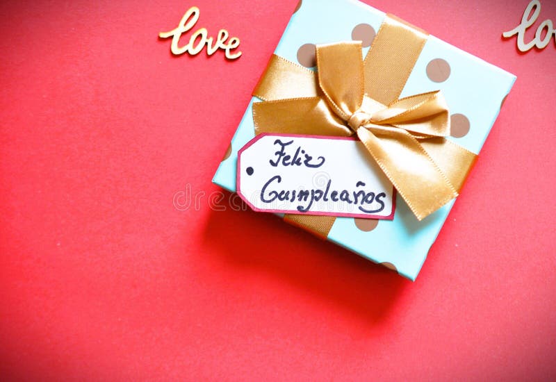 Birthday Present with Feliz Cumpleanos Gift Card Stock Photo - Image of ...