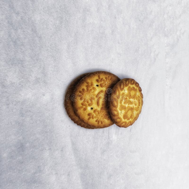 Biscuits on a White Surface, One Round and One Rectangular Stock Photo ...