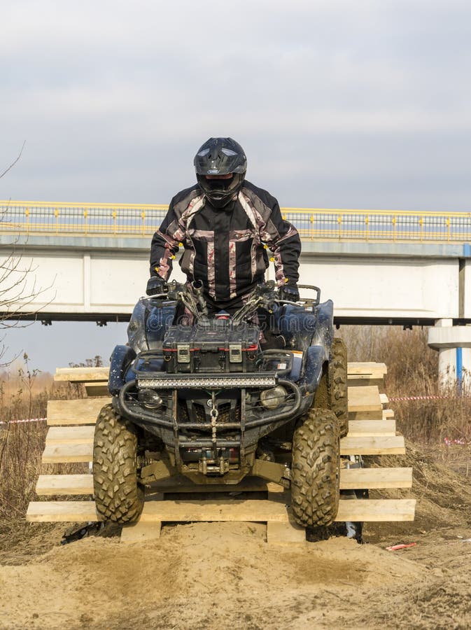 ATV Driver during the Exit from the Obstacle in Training. Editorial ...