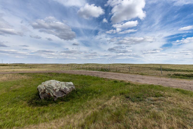 Bison Stone in the Prairie of Canada Stock Photo - Image of cloud ...