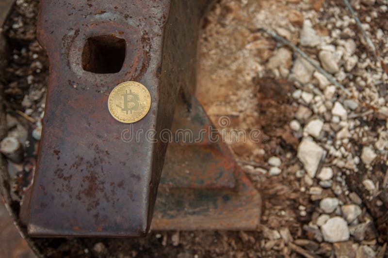 Bit coin on anvil stock image. Image of binary, financial - 128274527
