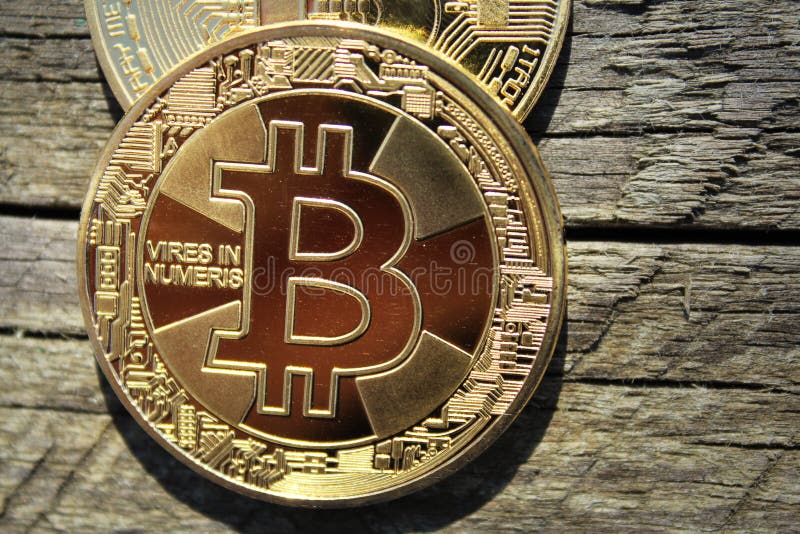 Bitcoin Blockchain Cryptocurrency.Virtual Money.Golden Coin on a Wood ... Bitcoin Blockchain Cryptocurrency.Virtual Money.Golden Coin on a Wood ...