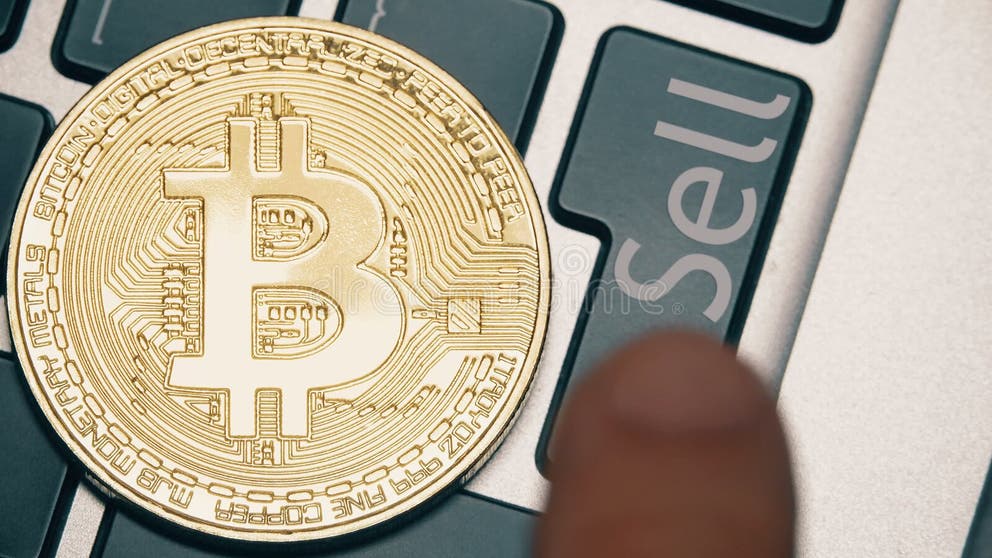 Bitcoin on the Computer Keyboard and the Sell Button Being Pressed ...