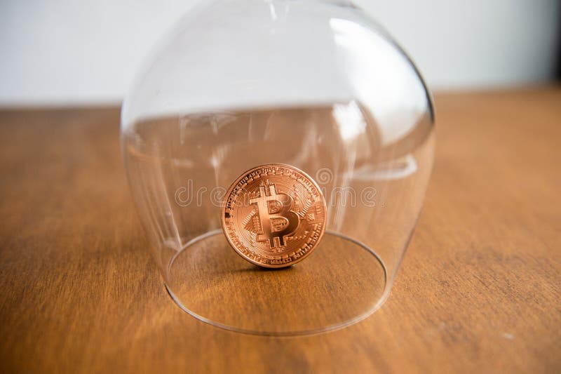 Bitcoin covered by a glass stock photo. Image of industry - 134495608
