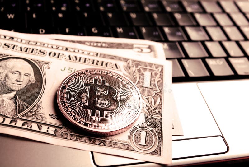 Bitcoin on Dollar Bill Over Laptop Stock Image - Image of gold, bitcoin ...