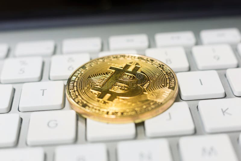 Bitcoin Gold Coin on a Computer Keyboard Stock Photo - Image of bank ...