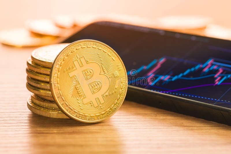 Bitcoin Gold Coin. Cryptocurrency and Business Chart in Cellphone Stock ...