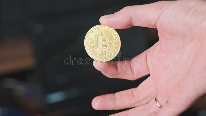 Bitcoin in Hand on a Cryptocurrency Exchange Chart Background on Laptop ...