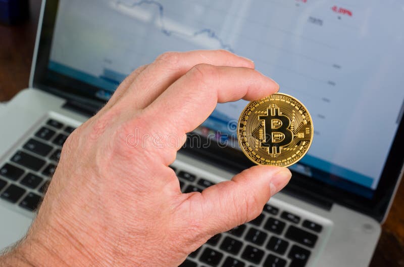 Bitcoin in hand stock image. Image of banking, invest - 114205563